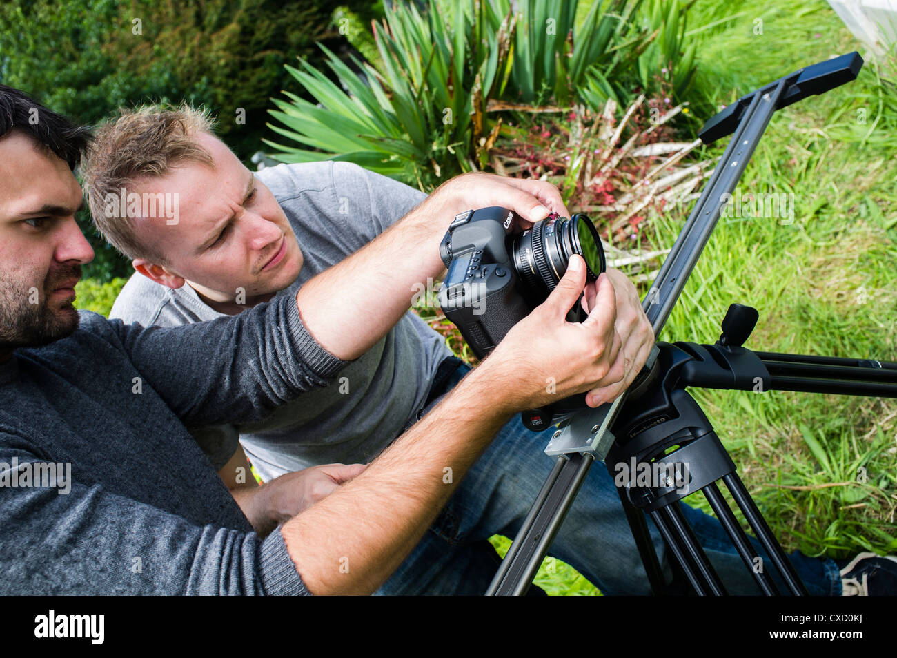 A small film crew making a short film using Canon DSLR cameras on a ...