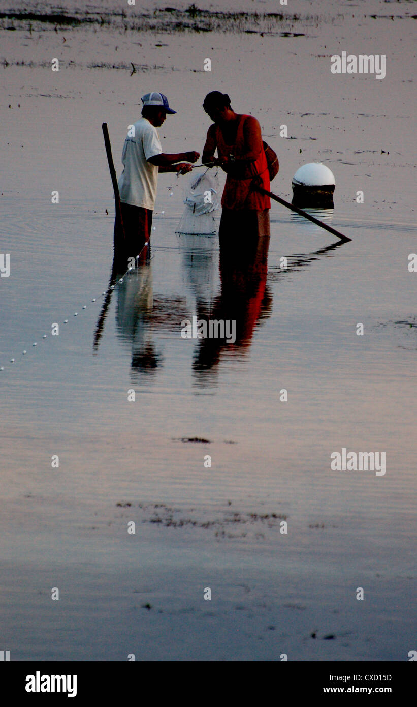 Men fishing in Bali Stock Photo - Alamy