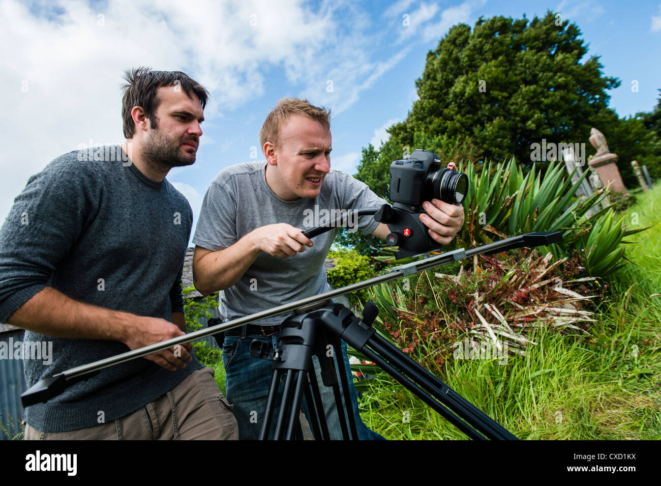 A small film crew making a short film using Canon DSLR cameras on a ...