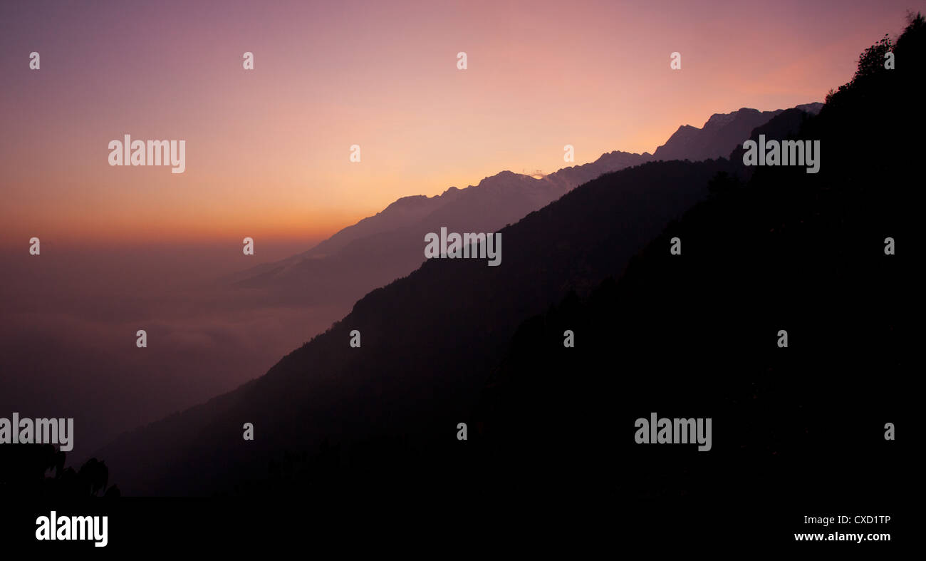 Silhouette of mountains at sunset against a lilac sky, near Ghopte ...