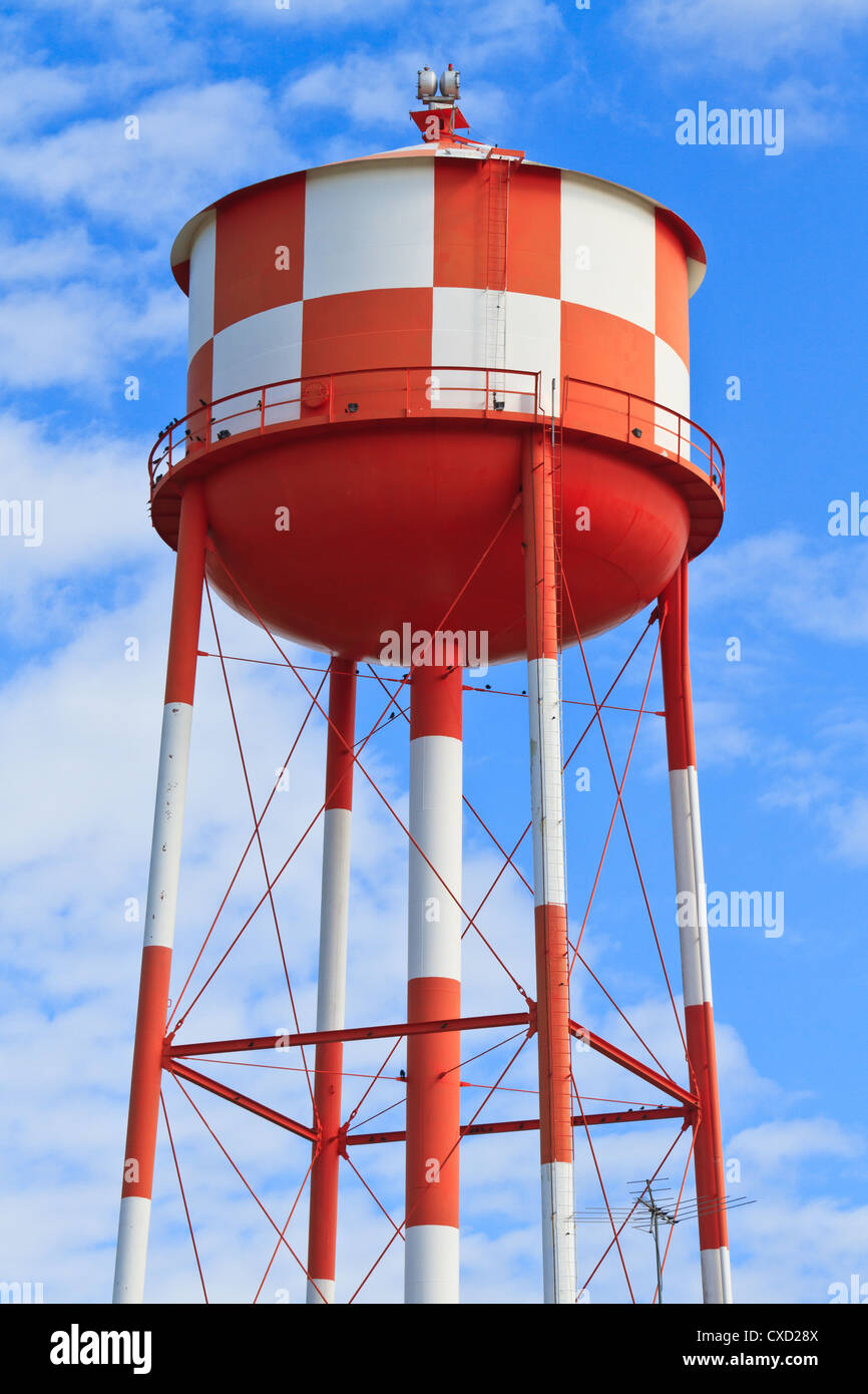 Water tower with red and white stripes (blue sky background Stock Photo ...