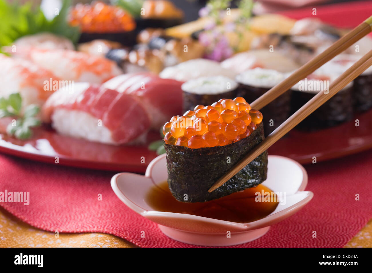 Salmon Roe Sushi Dipped into Soy Sauce Stock Photo - Alamy