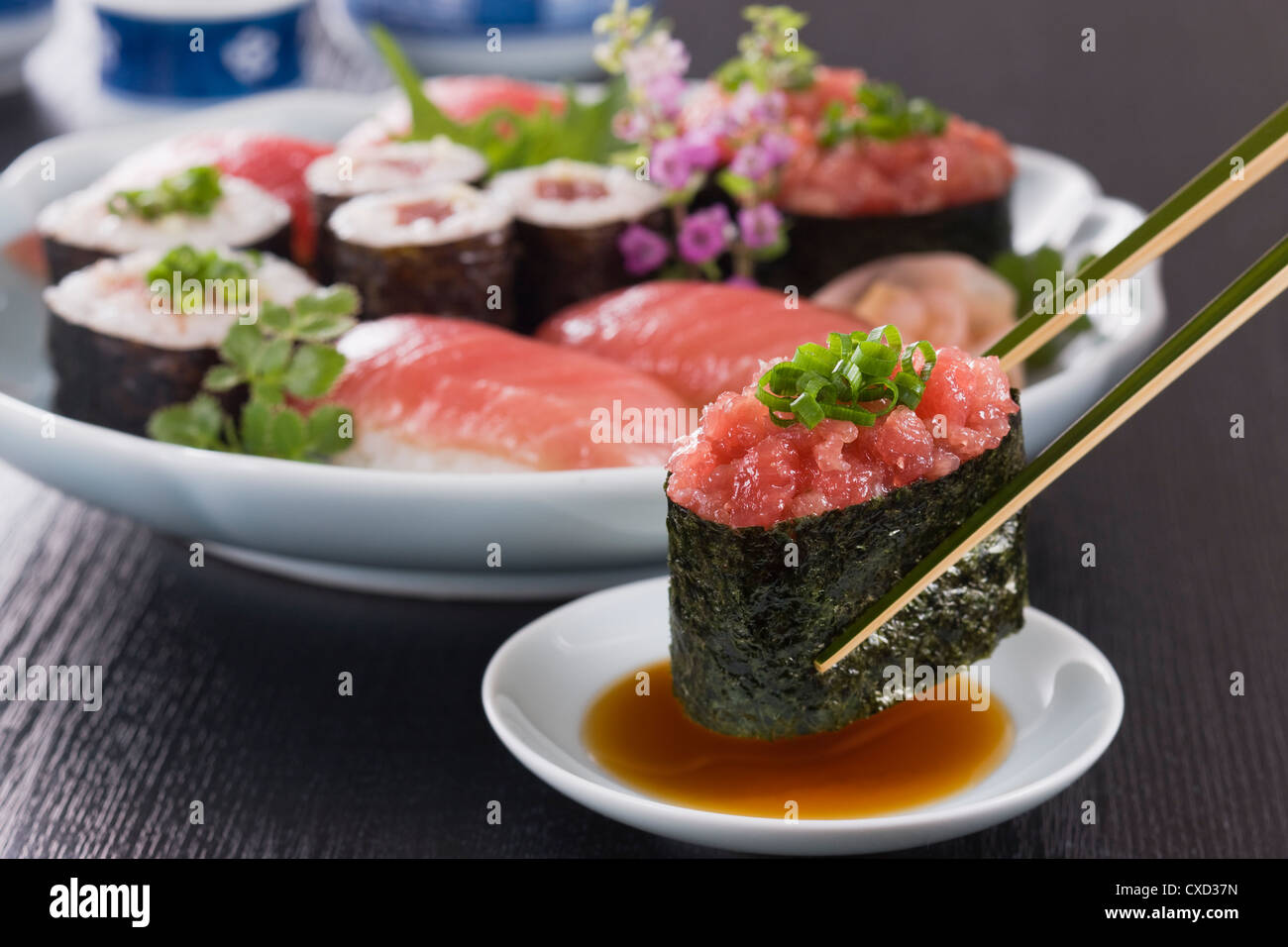 Negitoro Sushi Dipped into Soy Sauce Stock Photo - Alamy