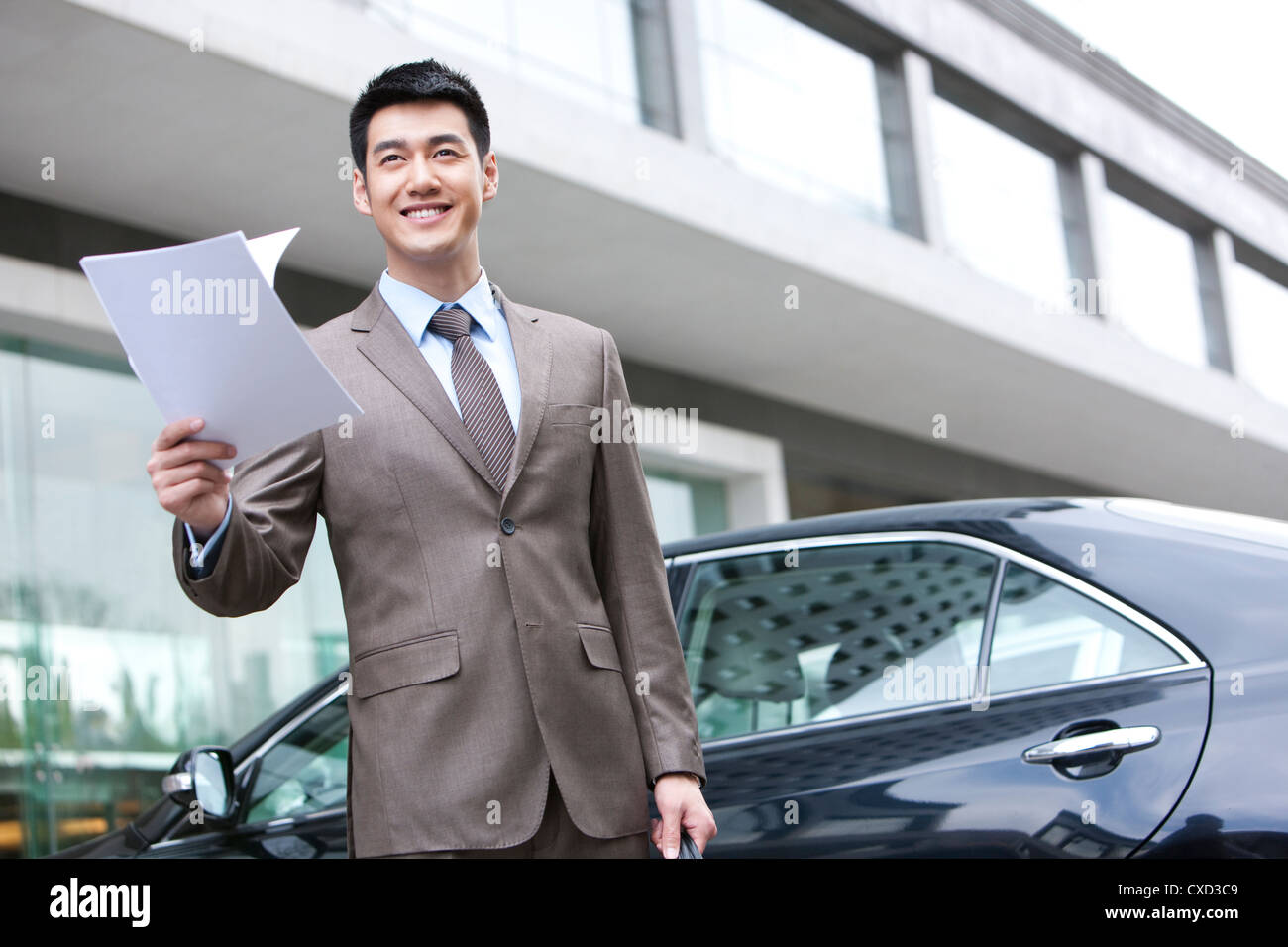 Young businessman reading file Stock Photo - Alamy Young businessman reading file Stock Photo - Alamy