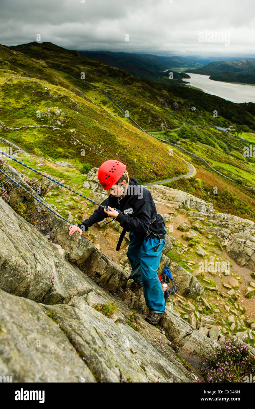 Rock Climbing in the Mawddach valley north wales: Teenagers taking part ...