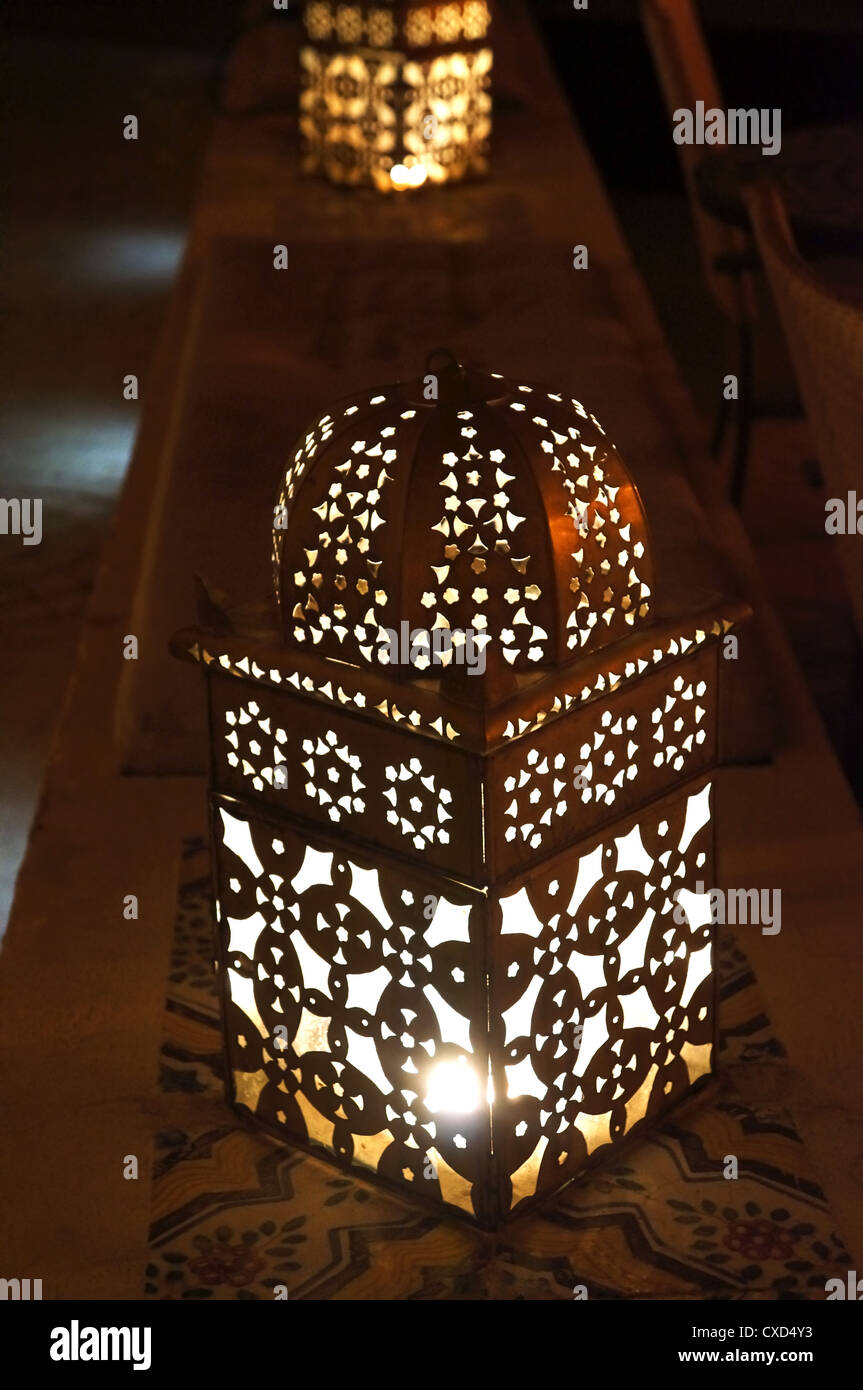 Close up view of an illuminated and metallic lantern from arab ...