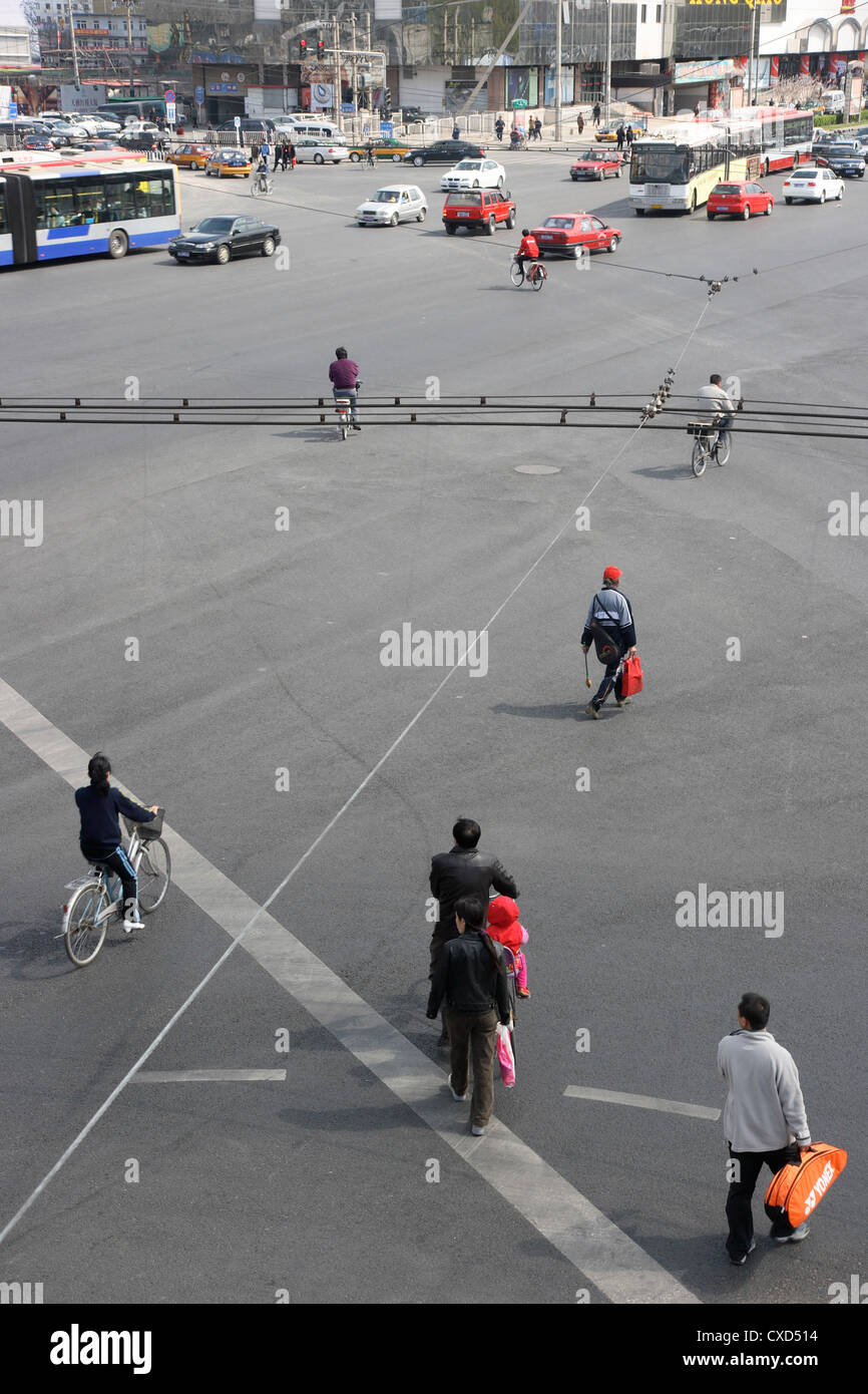 Beijing, People cross a large intersection Stock Photo - Alamy