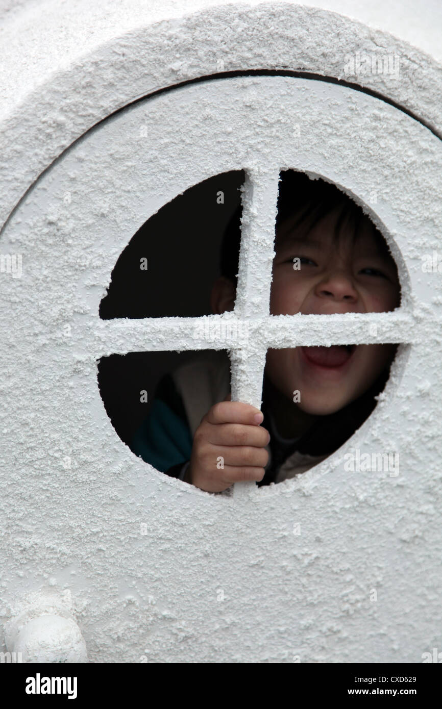 It's a igloo made from polystyrene plastic. There is a kid inside who ...