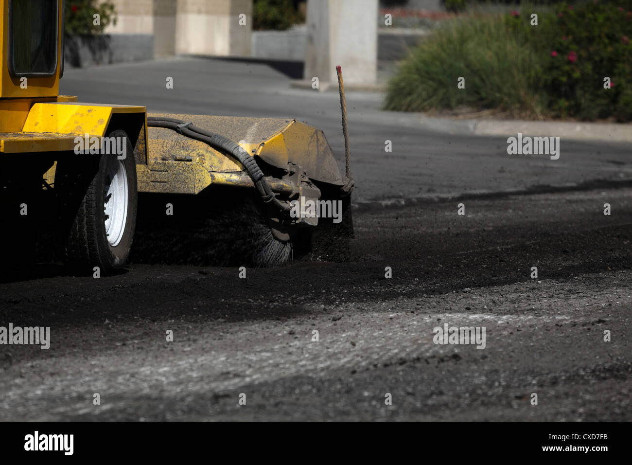Rotary road sweeper clearing milling debris from road surface Stock ...