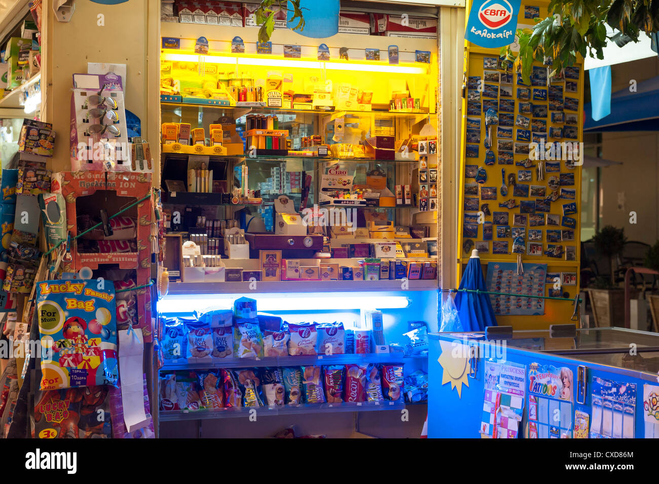 Traditional and ubiquitous street corner kiosk (periptero) selling ...