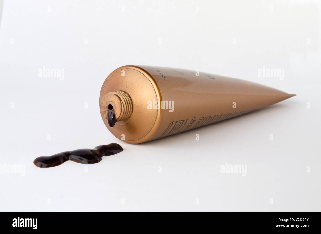Fake Tan tube squeezed out on white background Stock Photo - Alamy