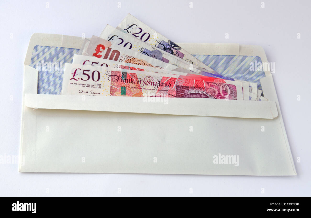 Pound notes in a white envelope on white background Stock Photo - Alamy