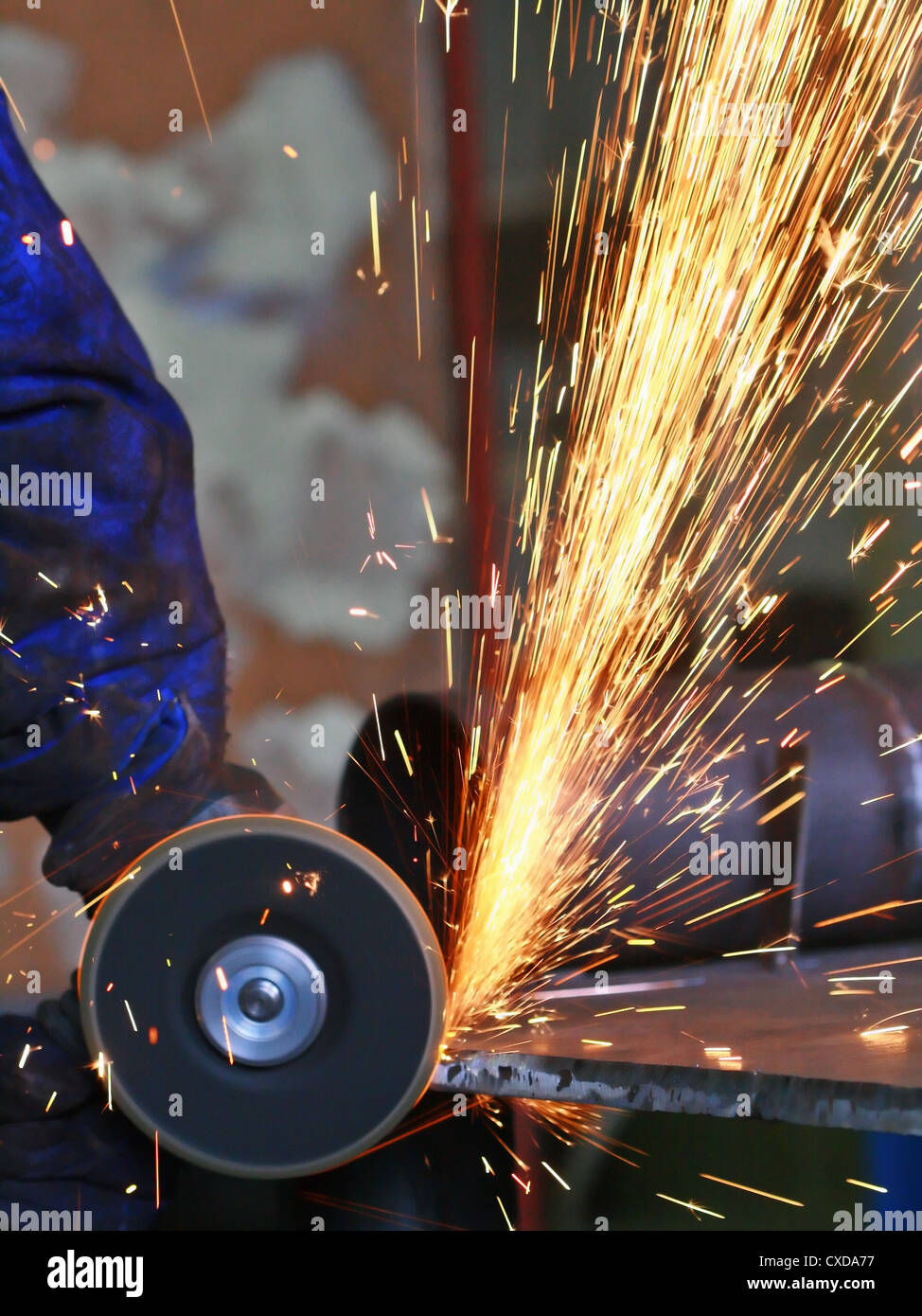 Yellow hot sparks at grinding steel material Stock Photo - Alamy