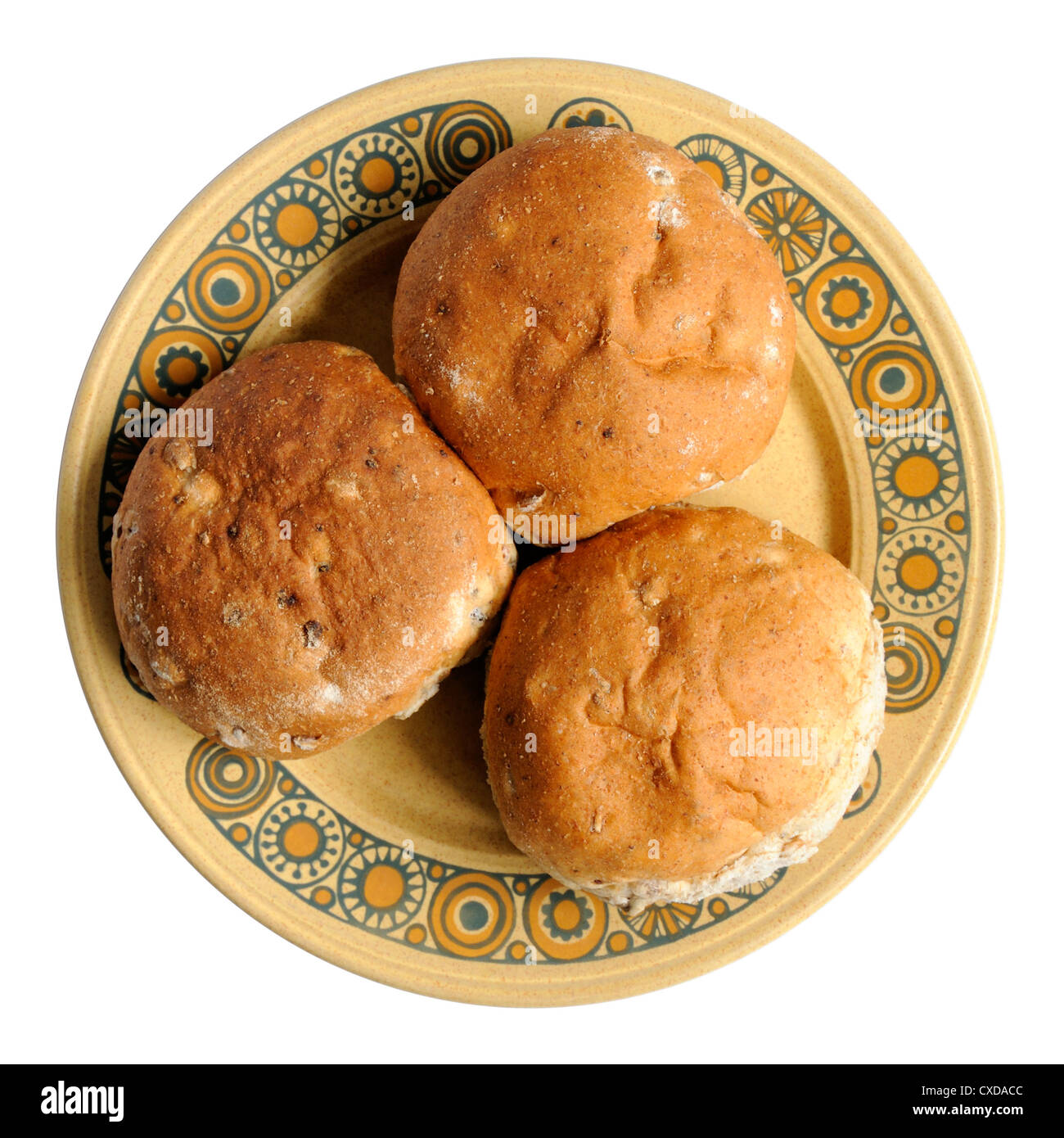three brown bread rolls on plate Stock Photo - Alamy