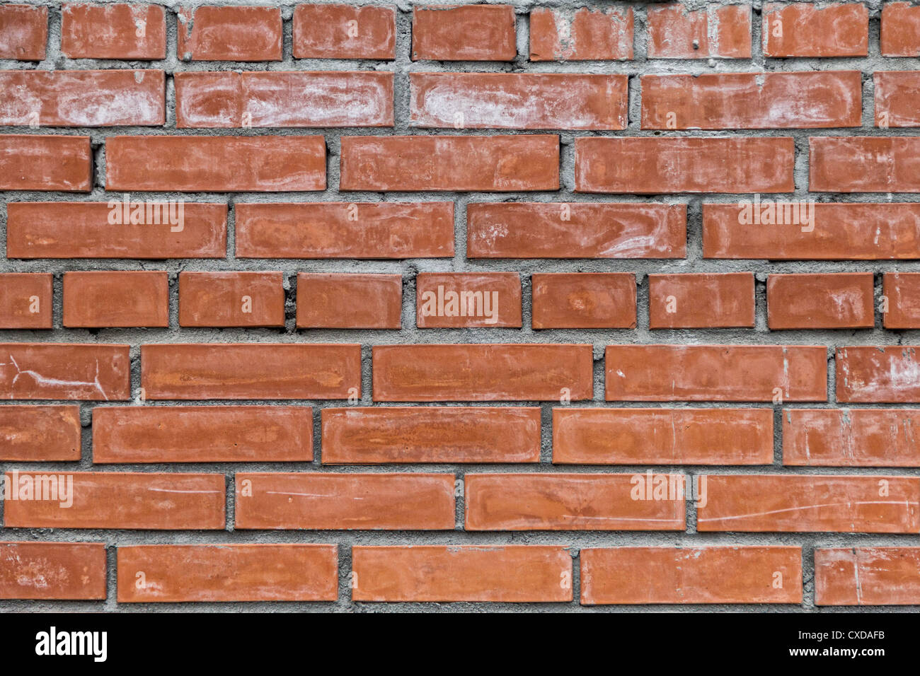 red dirty brick wall texture with cracks Stock Photo - Alamy
