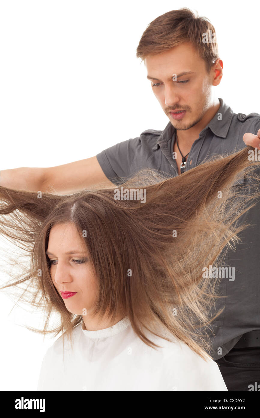 Professional hairdresser with long hair model Stock Photo - Alamy