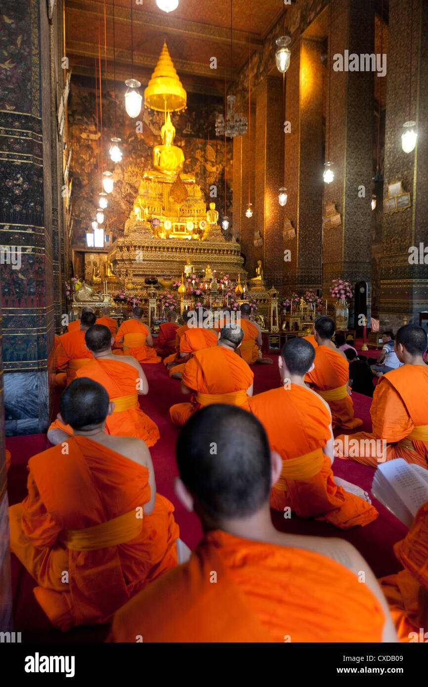 Theravada monks praying in a Buddhist temple Bangkok Thailand Stock ...