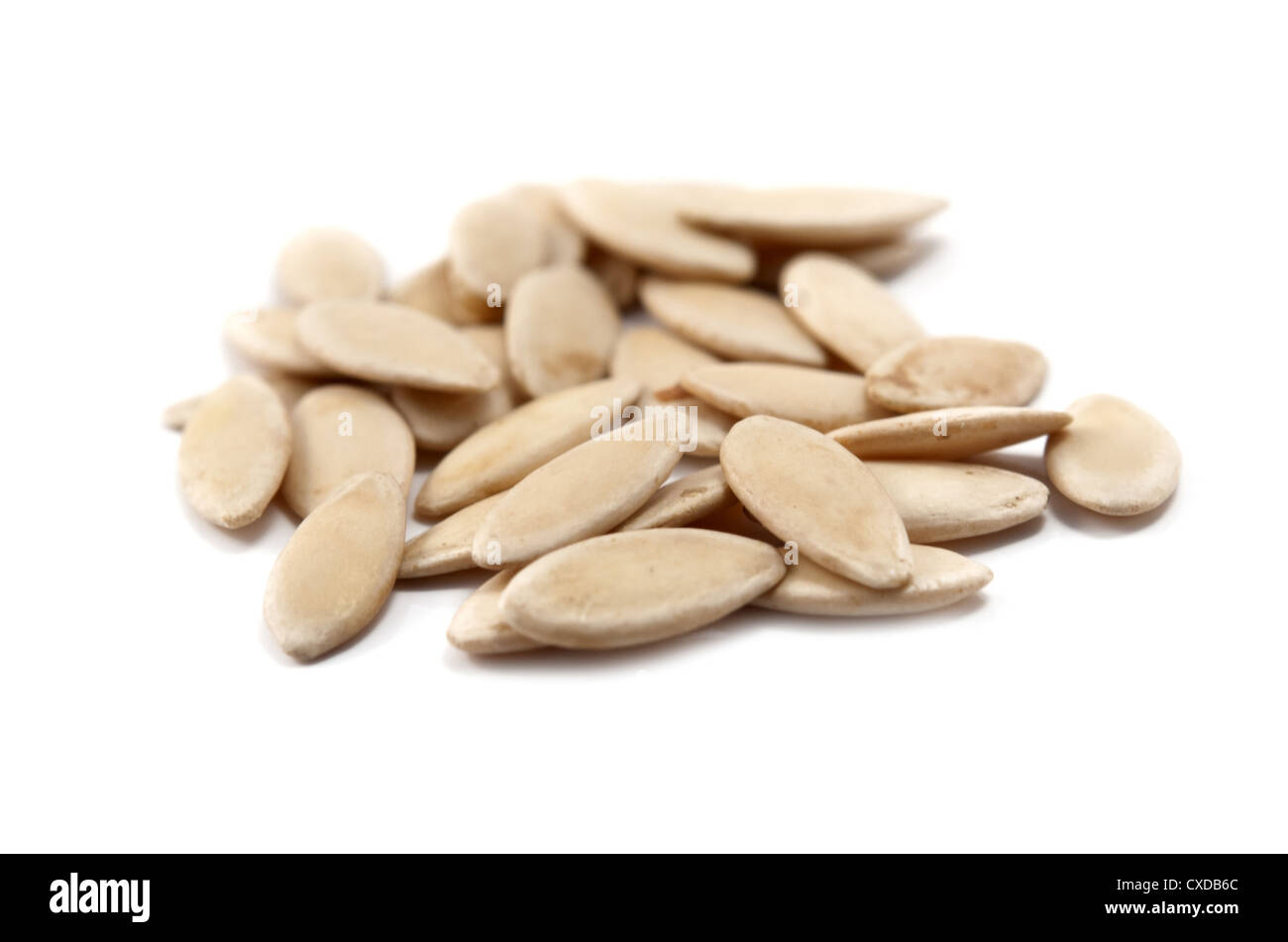pile of pumpkin seed isolated on white background Stock Photo - Alamy