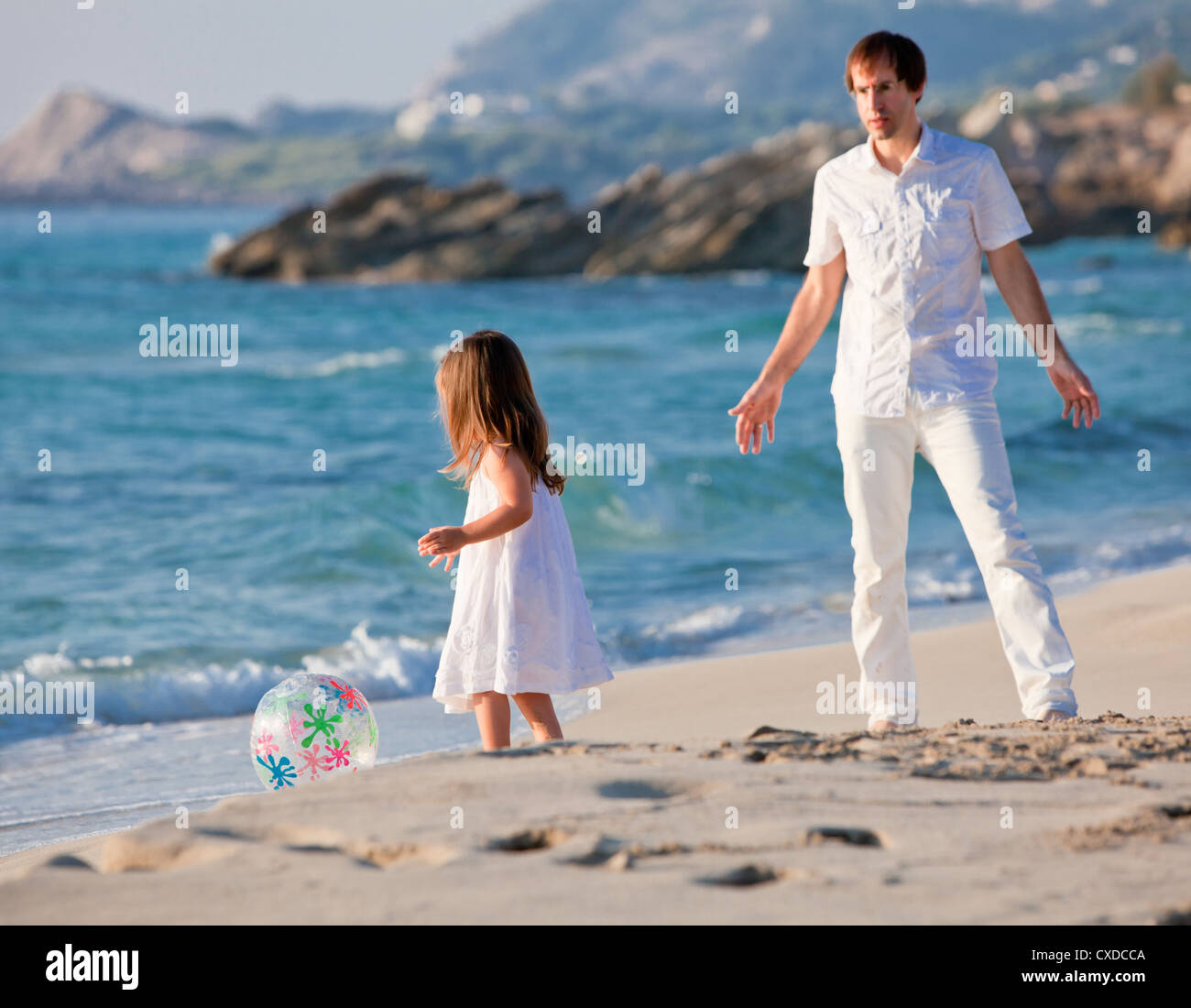 happy family father and daughter on beach having fun summer vacation Stock Photo - Alamy