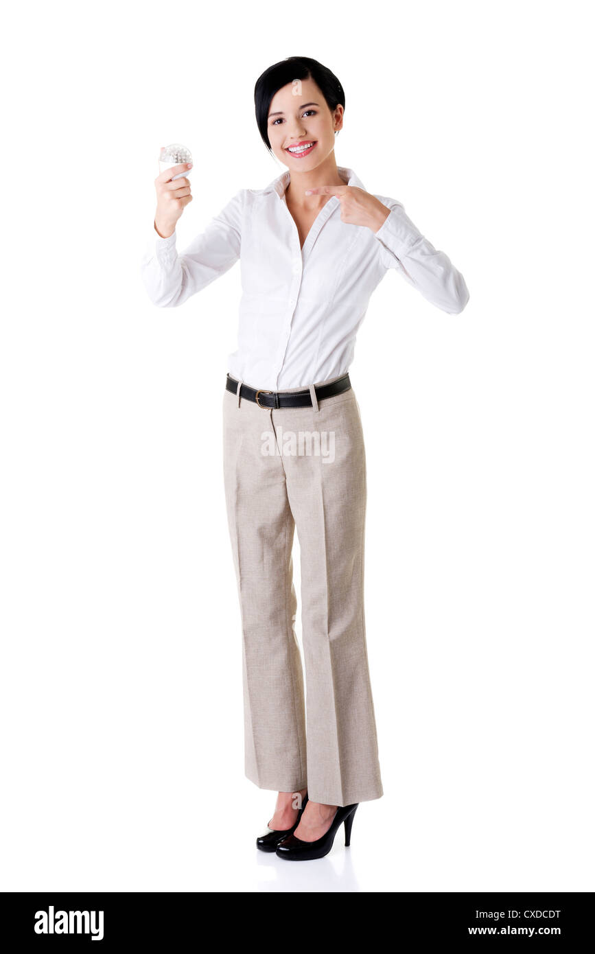 Happy young business woman holding led bulb Stock Photo - Alamy
