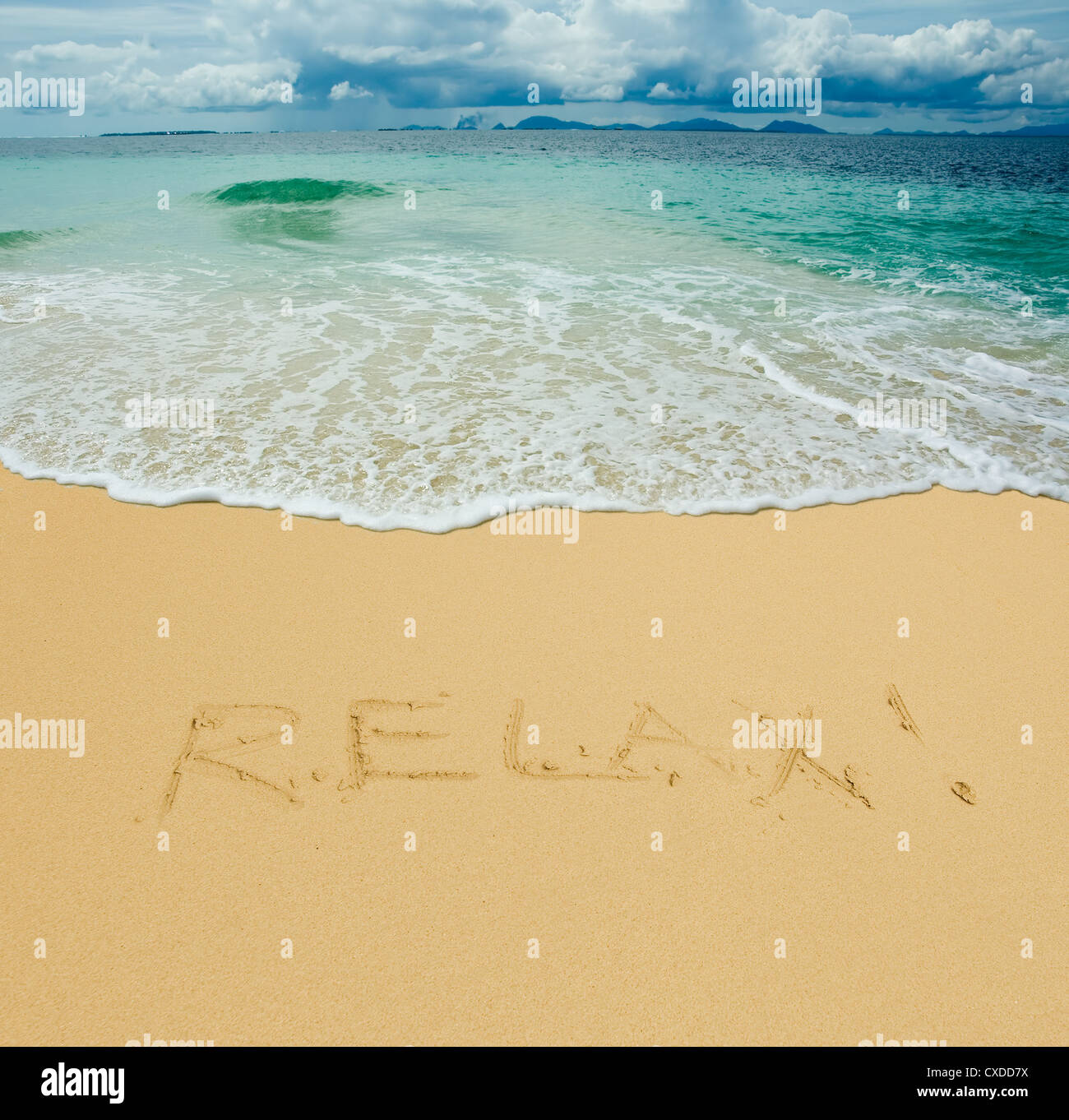 Relax written in sand wave hi-res stock photography and images - Alamy