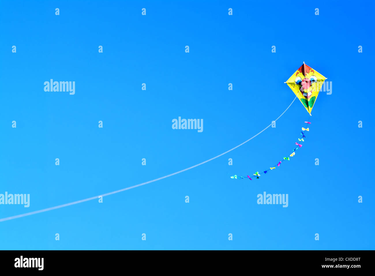 Colored kite sails on a clear blue sky Stock Photo - Alamy