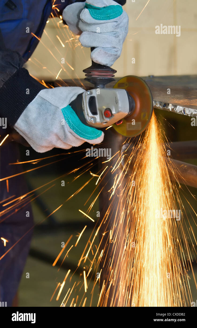 Yellow hot sparks at grinding steel material Stock Photo - Alamy