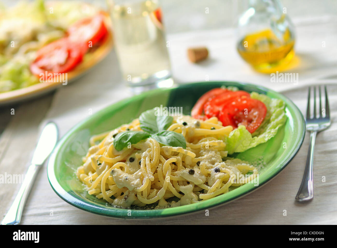 fresh hot spaghetti with cheese sauce with pepper Stock Photo - Alamy
