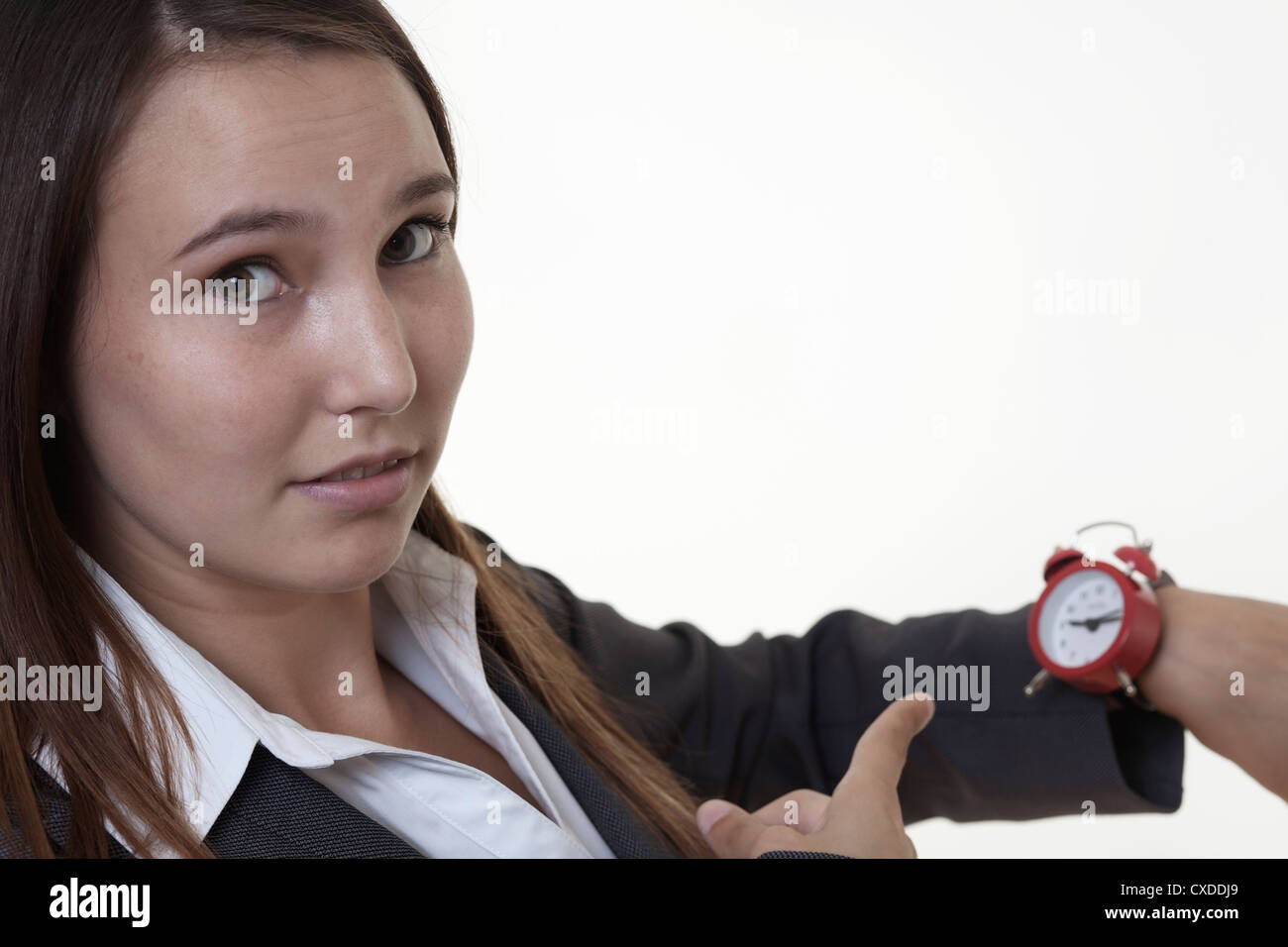 young looking woman looking at her wrist watch Stock Photo - Alamy