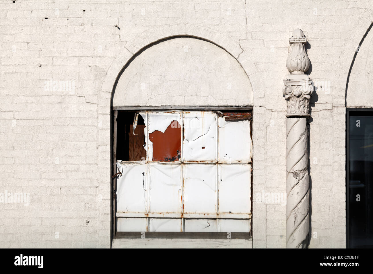 Dilapidated arched window and decorative pillar Stock Photo - Alamy