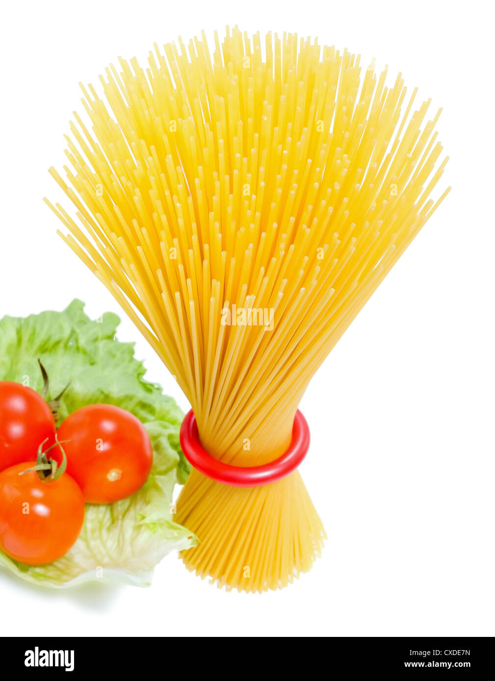 Spaghetti standing on white in a decorative way Stock Photo - Alamy