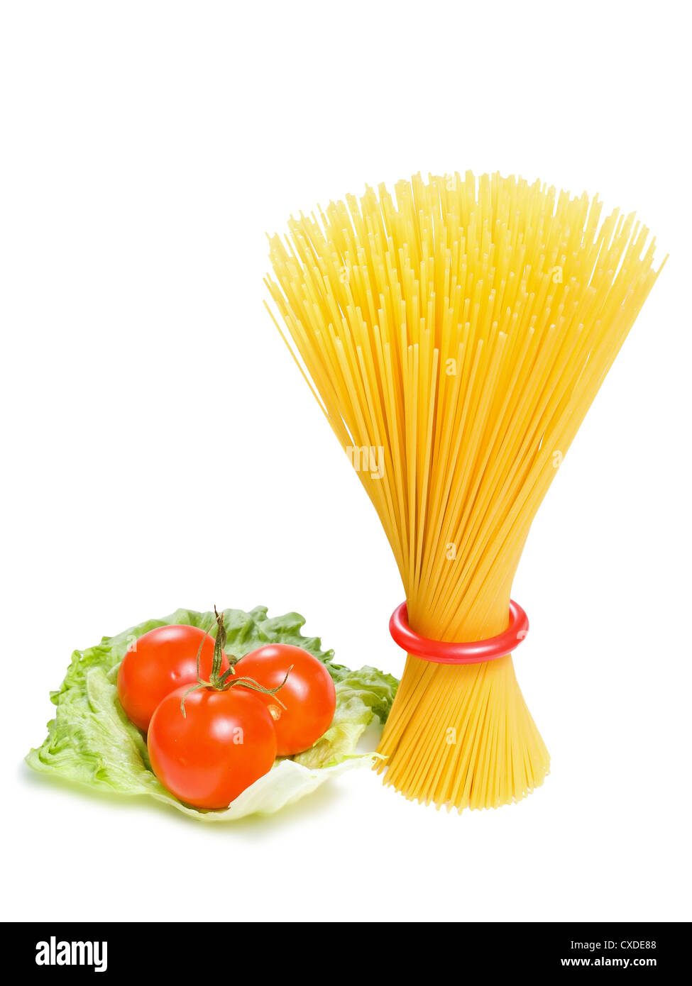 Spaghetti standing on white in a decorative way Stock Photo - Alamy