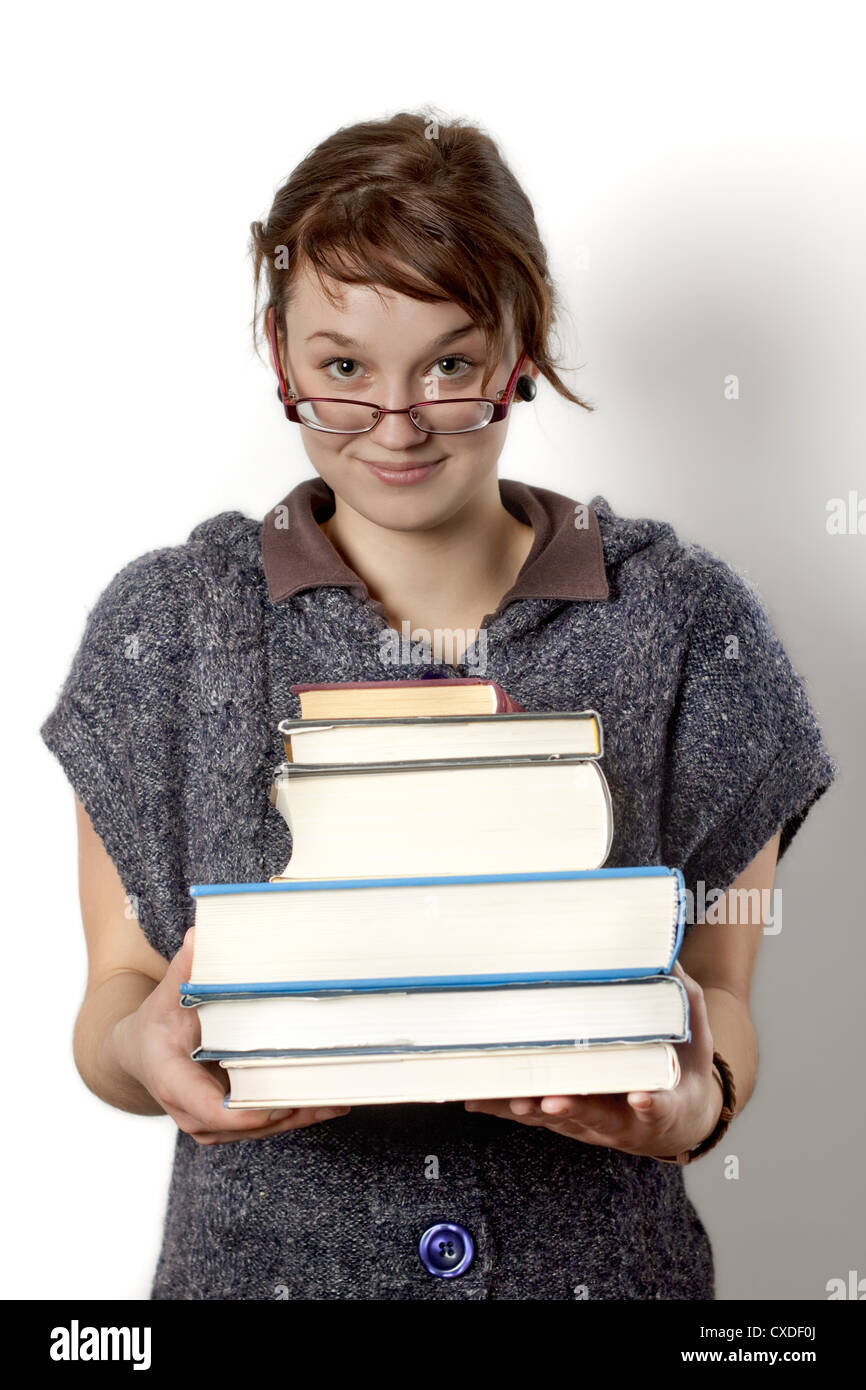 Photo of young girl studying with books Stock Photo - Alamy