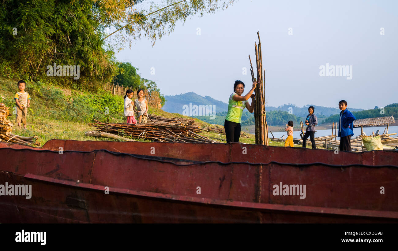 Group of villagers on the shores of Ba Be lake Stock Photo - Alamy