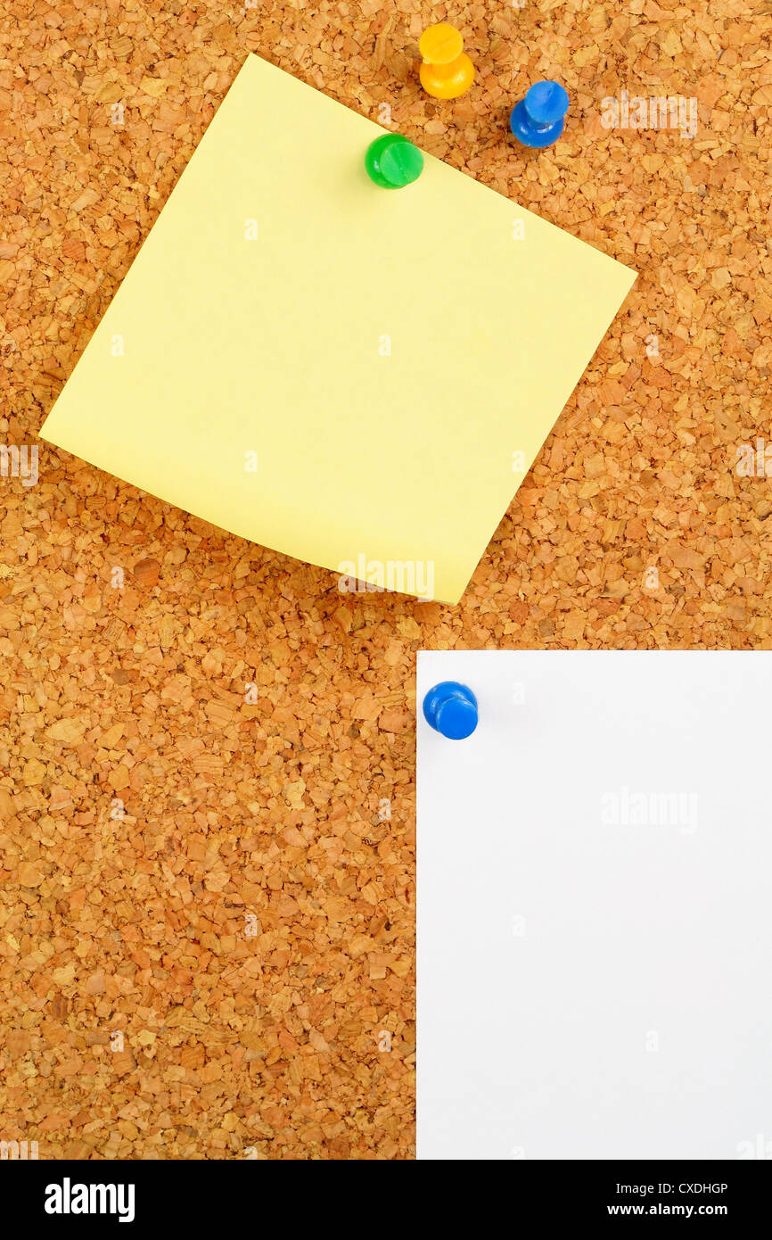 Paper of note with tack on cork noticeboard Stock Photo - Alamy