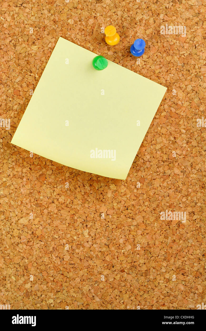 Paper of note with tack on cork noticeboard Stock Photo - Alamy