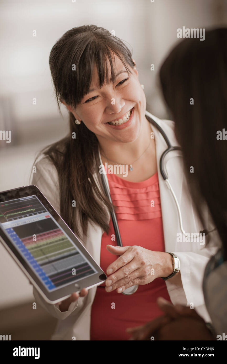 African american doctor showing tablet hi-res stock photography and ...