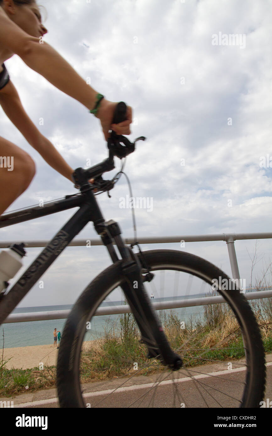 Woman riding on bike path spain hi-res stock photography and images - Alamy