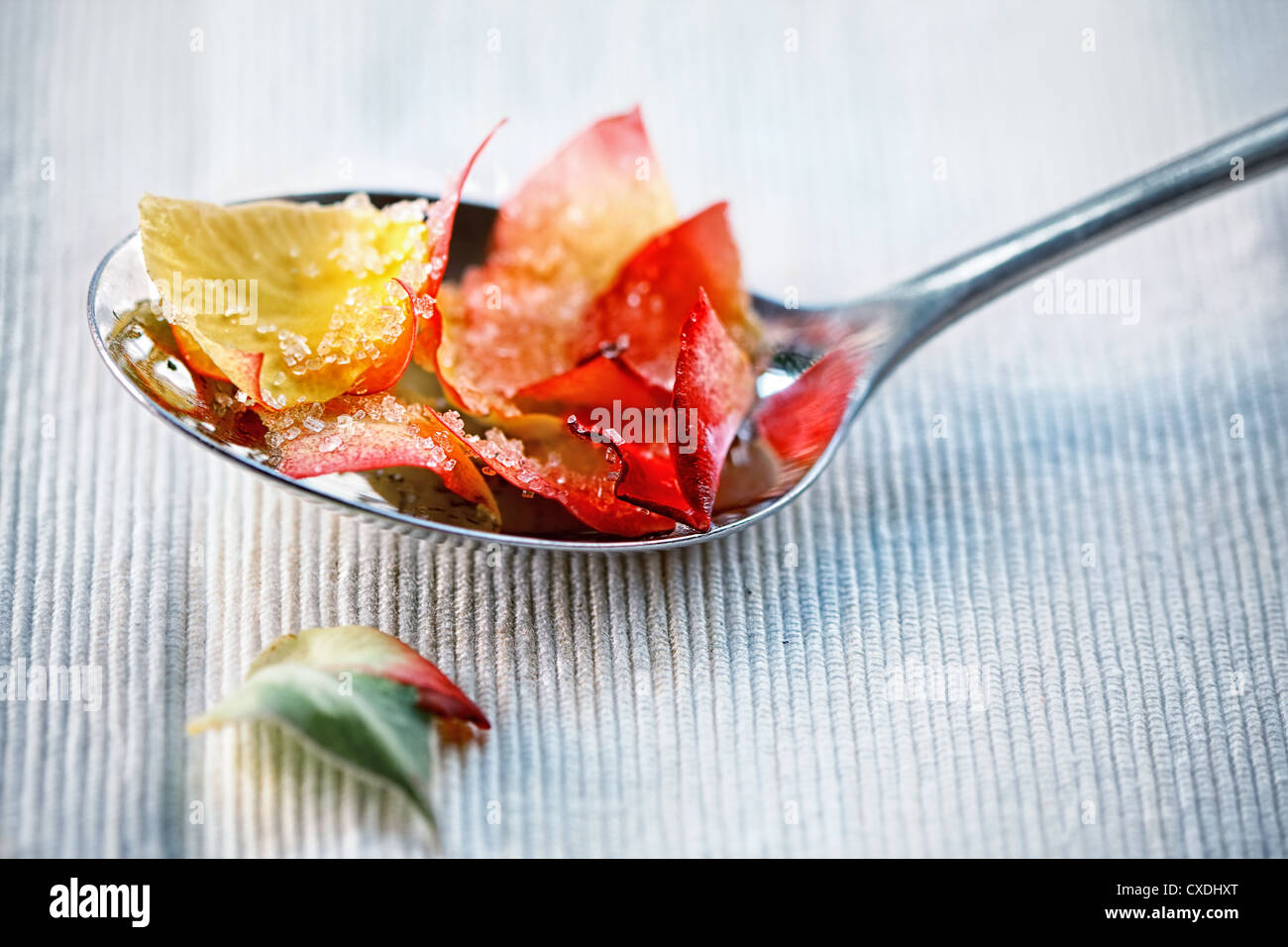Candied rose petals on spoon Stock Photo - Alamy