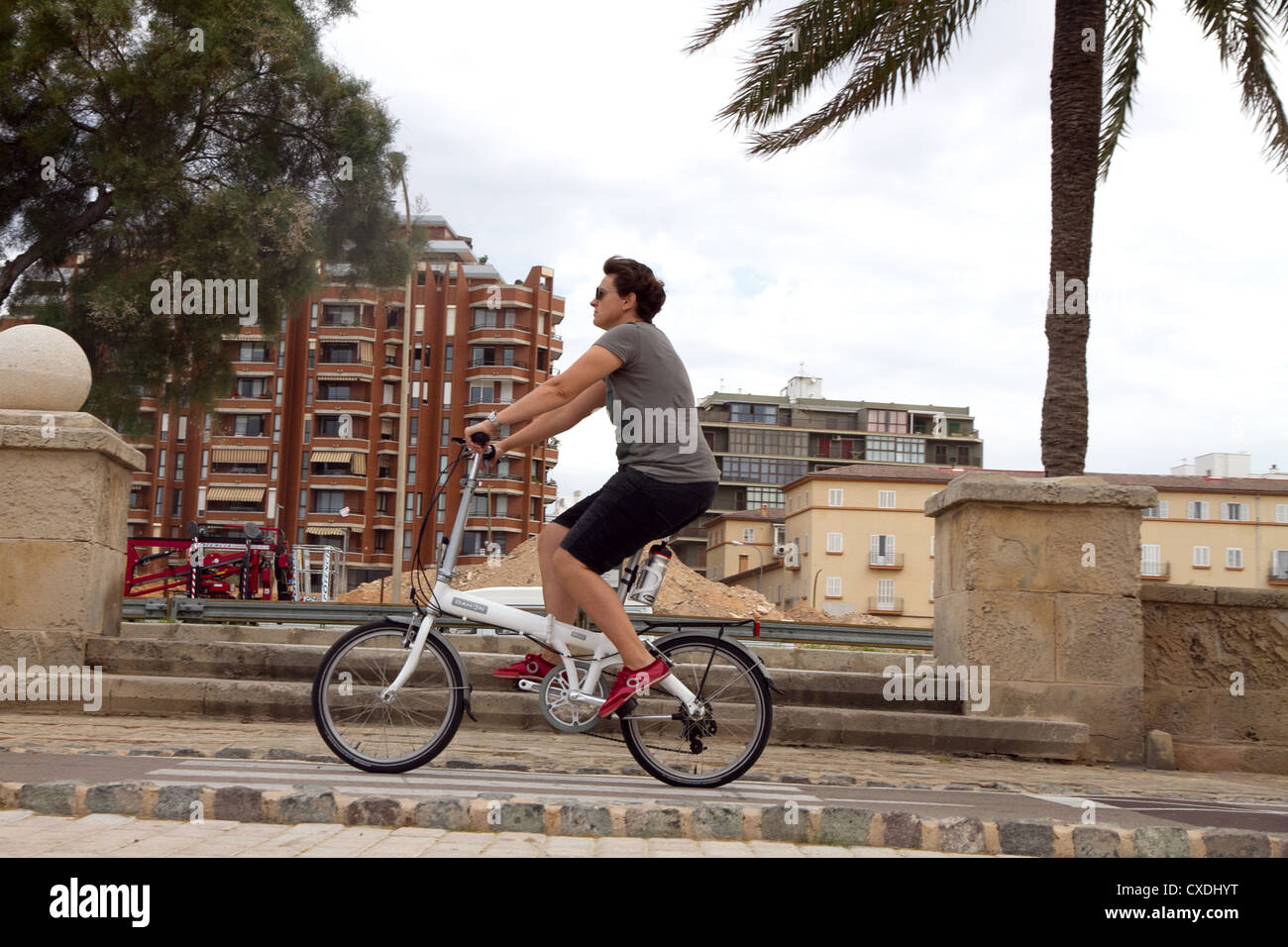 Woman Riding bike on path, person cycling on bicycle path on promenade ...