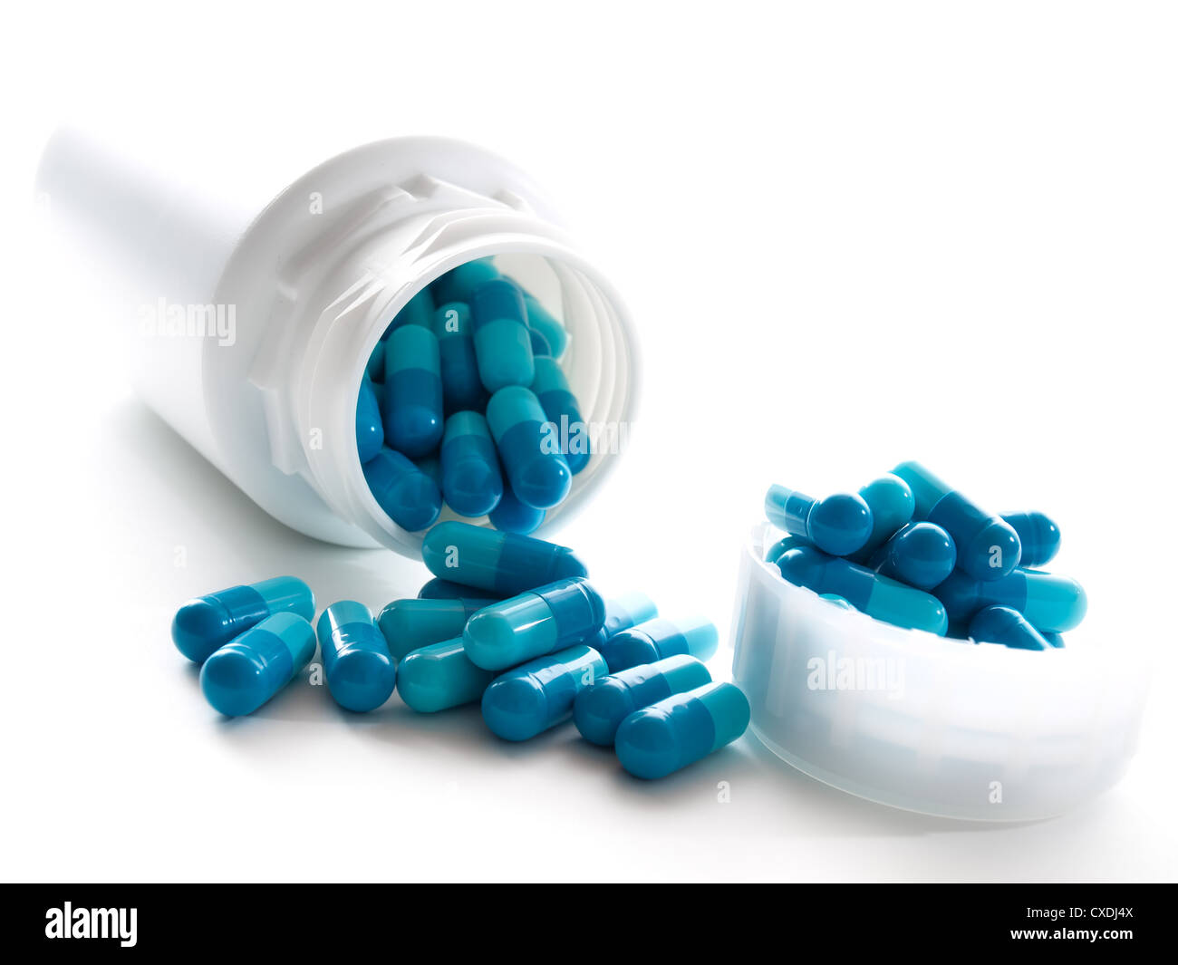 Plastic container with blue gel capsules on a white background Stock ...