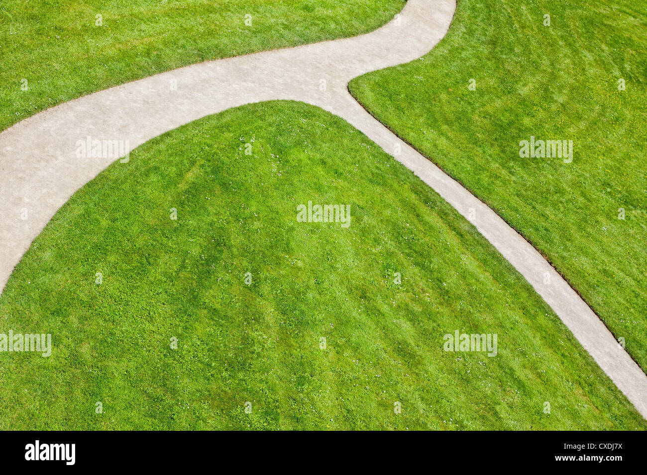 sandy path - pavement and grass Stock Photo - Alamy