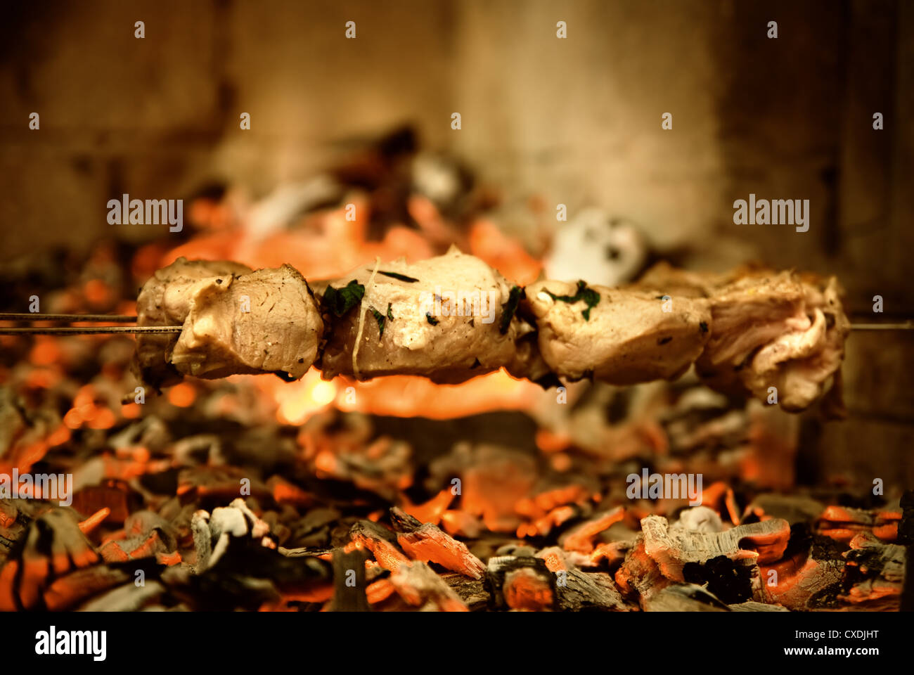 fried meat on fire Stock Photo - Alamy