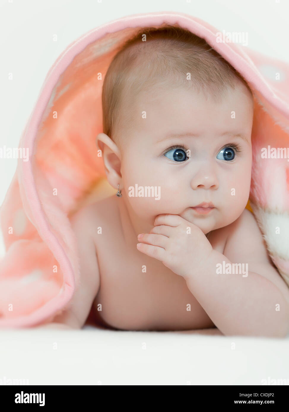 Charming baby. Beautiful baby under pink towel Stock Photo - Alamy
