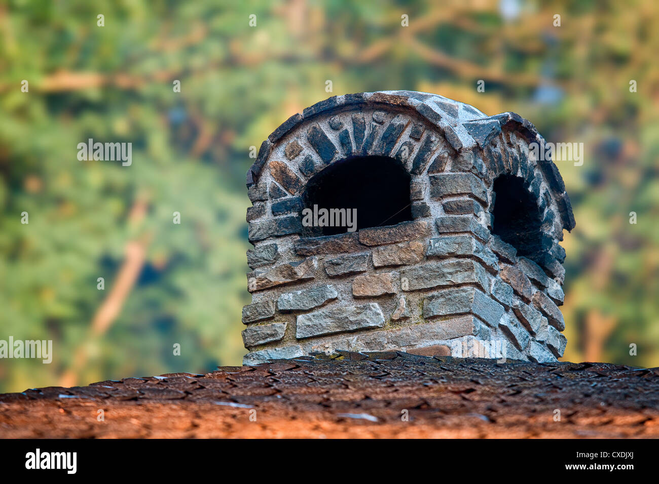 Small stone chimney Stock Photo - Alamy