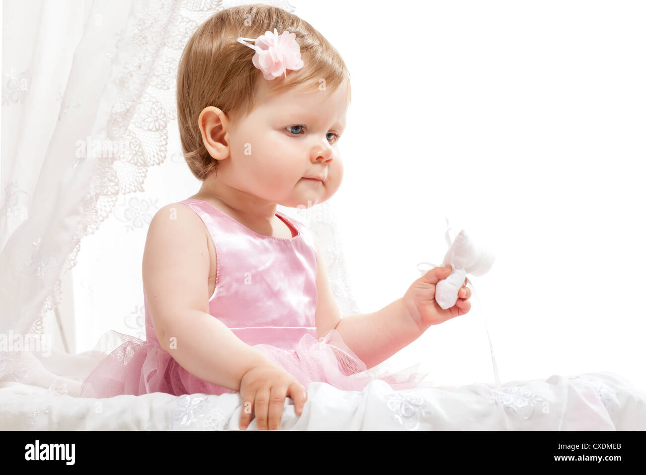 Cute little girl sitting in baby buggy Stock Photo - Alamy