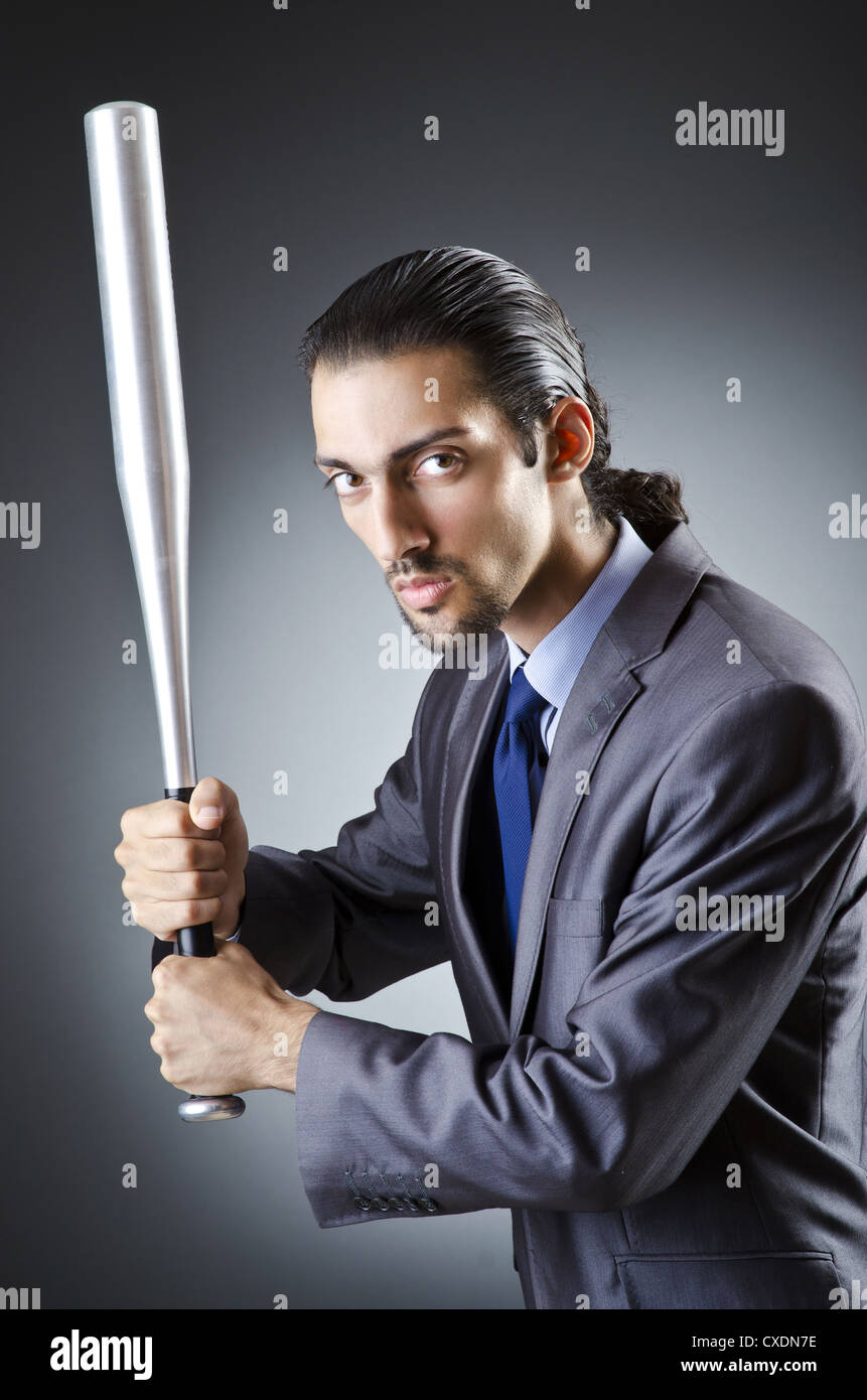 Angry businessman with bat on white Stock Photo - Alamy