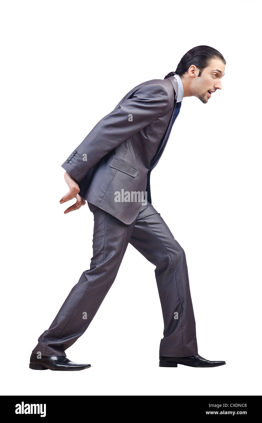 Young businessman pushing invisible obstacles Stock Photo - Alamy