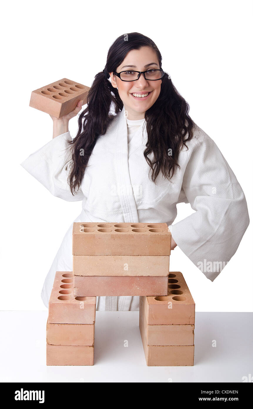 Woman karate breaking bricks on white Stock Photo - Alamy