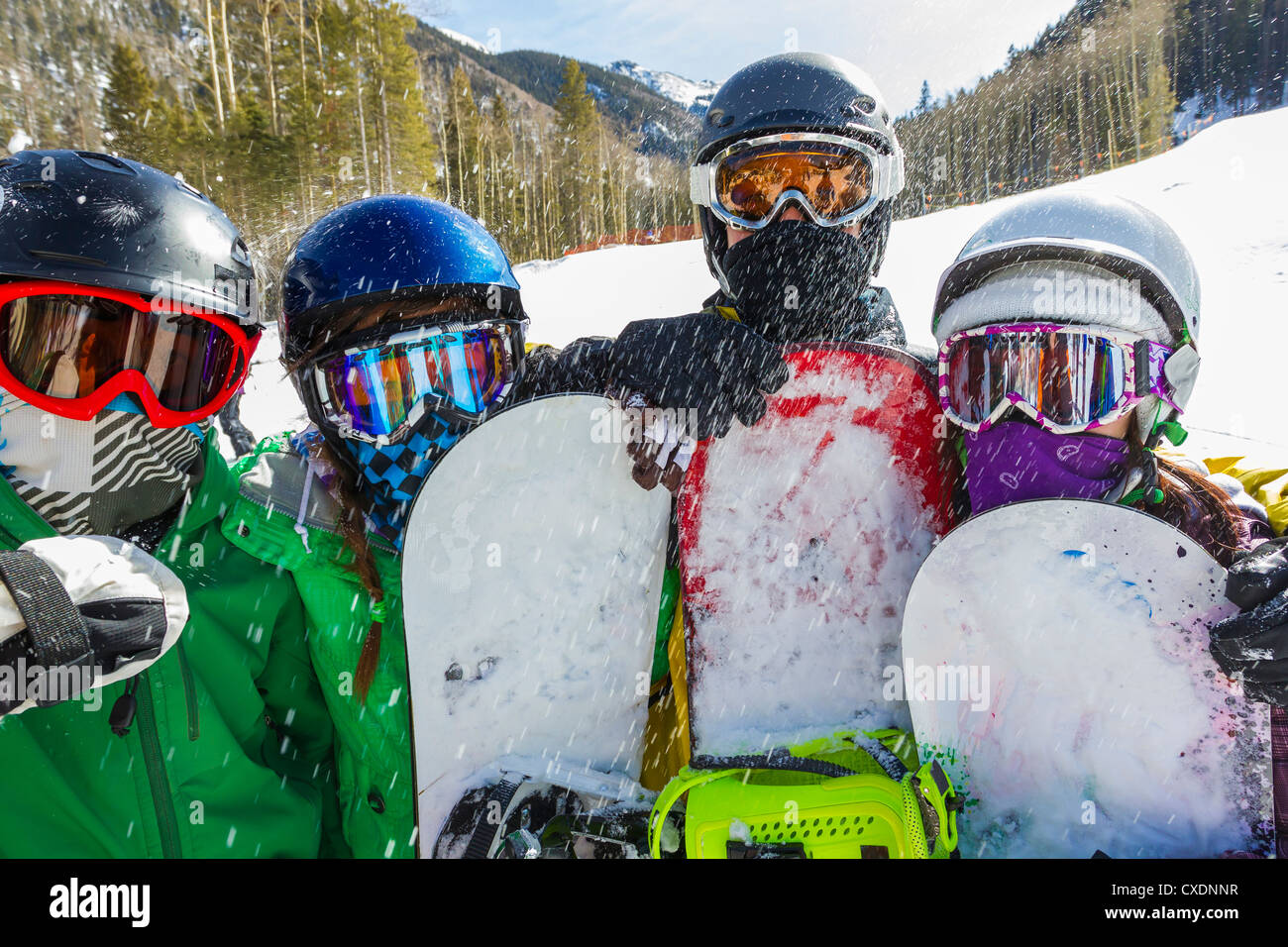 Teenagers snowboarding together Stock Photo - Alamy